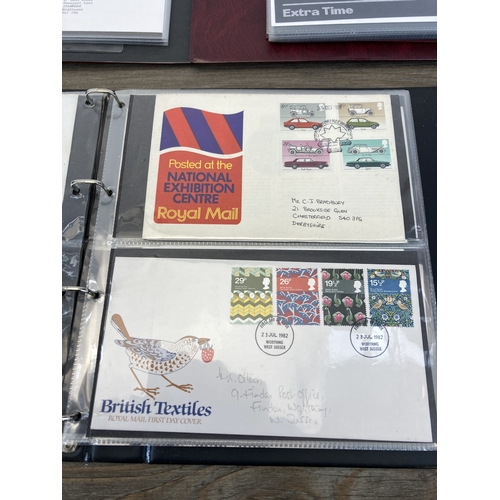 Three albums containing a collection of British first day covers and stamps