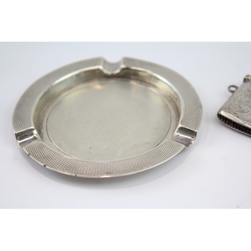 Three pieces of sterling silver tobacciana, two vesta cases and one ...