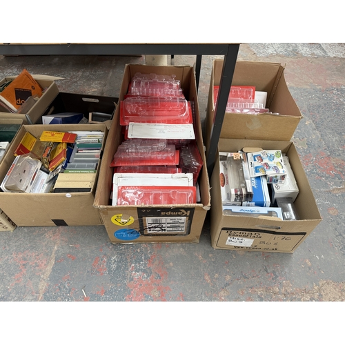 Twelve boxes containing a large collection of empty toy boxes