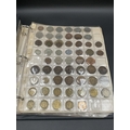 A coin album containing world coins with silver examples to include 90% ...