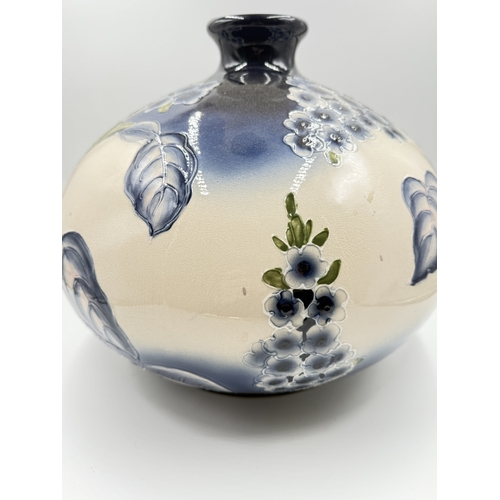 A Moorcroft style tubelined ceramic vase - approx. 29cm high
