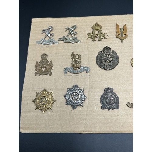 Approx. eighteen military cap badges