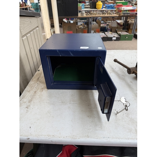 A Leigh Safes blue metal safe with key