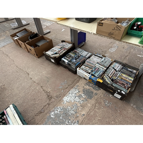 Seven boxes containing DVDs, Sanyo Dictaphone, Intempo water action ...