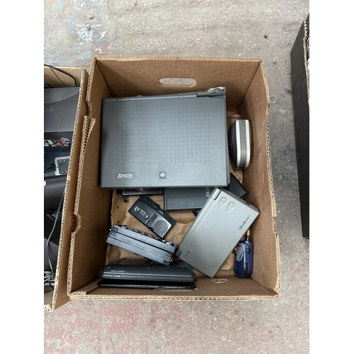 Seven boxes containing DVDs, Sanyo Dictaphone, Intempo water action ...