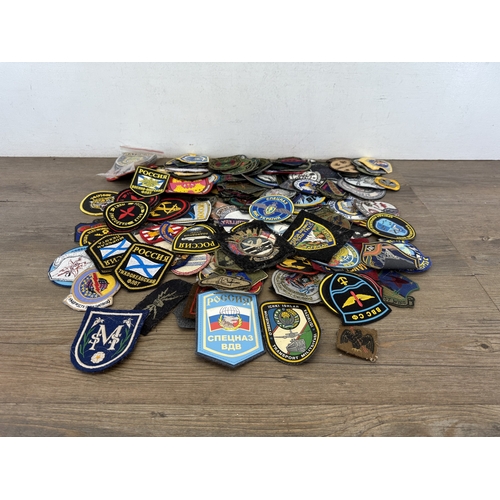 A large collection of military cloth patches