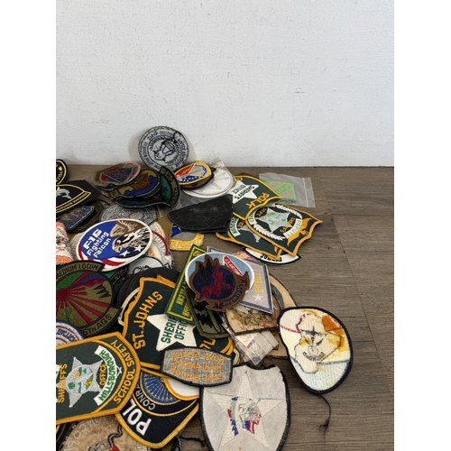 A large collection of military cloth patches