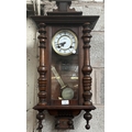 A Highlands mahogany cased chiming wall clock with pendulum and key ...