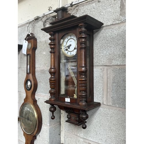 A Highlands mahogany cased chiming wall clock with pendulum and key ...