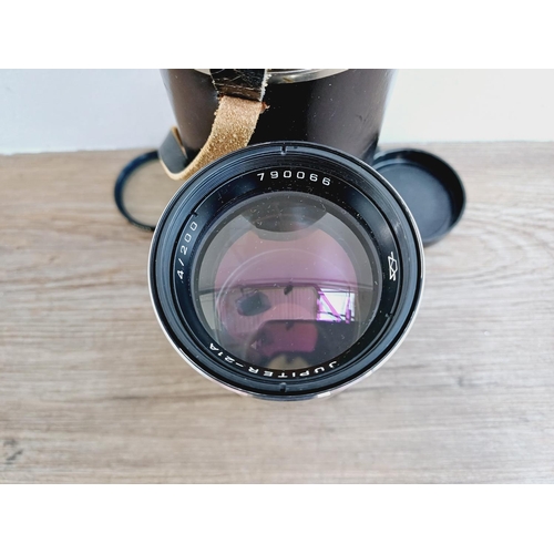 A cased KMZ Jupiter-21A 4/200 screw-mount lens with caps and KMZ UV filter