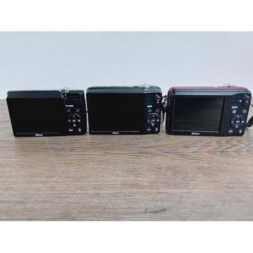 Three Nikon Coolpix CCD sensor compact digital cameras, one A10 16.1mp ...