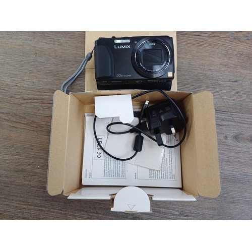 Four boxed Panasonic Lumix compact digital cameras, one DMC-TZ40 18mp ...