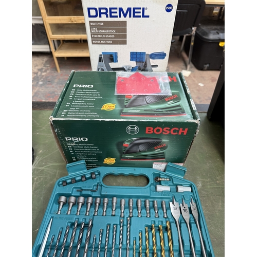 Five items, one Dremel Multi vice, one Bosch cordless multi sander, one ...