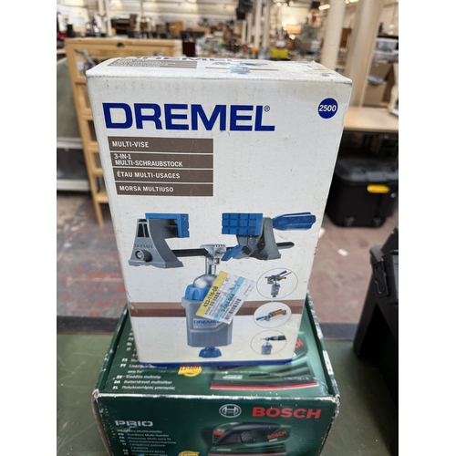 Five items, one Dremel Multi vice, one Bosch cordless multi sander, one ...