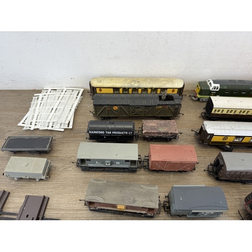 A collection of railway model vehicles to include Tri-ang D-459 garage ...