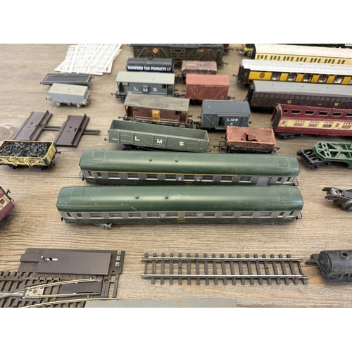 A collection of railway model vehicles to include Tri-ang D-459 garage ...