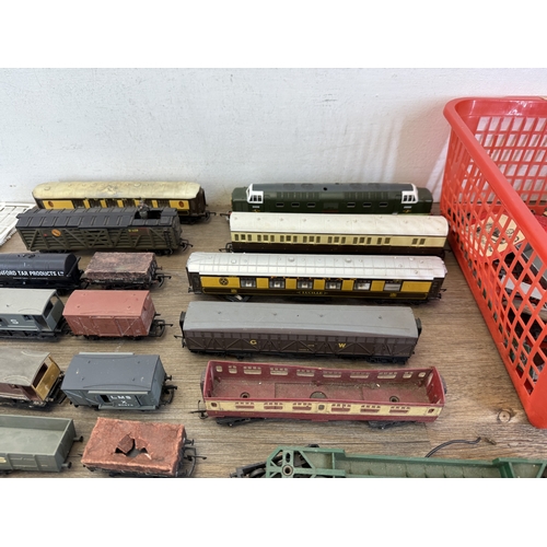 A collection of railway model vehicles to include Tri-ang D-459 garage ...
