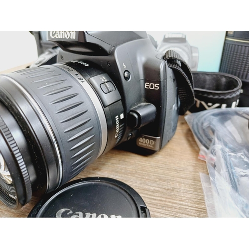 Three bagged cameras, one Canon EOS 400D 10.1mp DSLR fitted with EF-S 1 ...