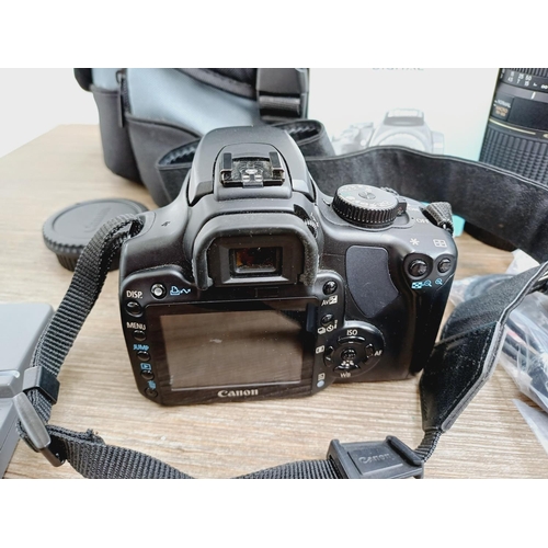 Three bagged cameras, one Canon EOS 400D 10.1mp DSLR fitted with EF-S 1 ...