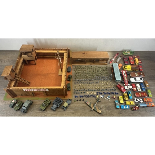 A collection of diecast model vehicles together with toy soldiers and a ...