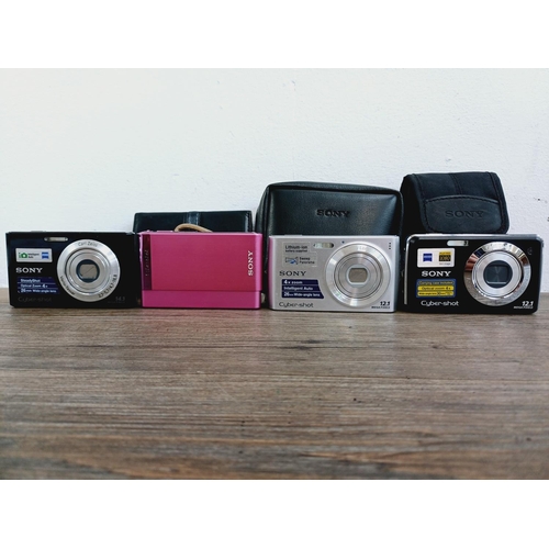 Four Sony Cyber-shot compact digital cameras, one DSC-W330 14.1mp, one ...