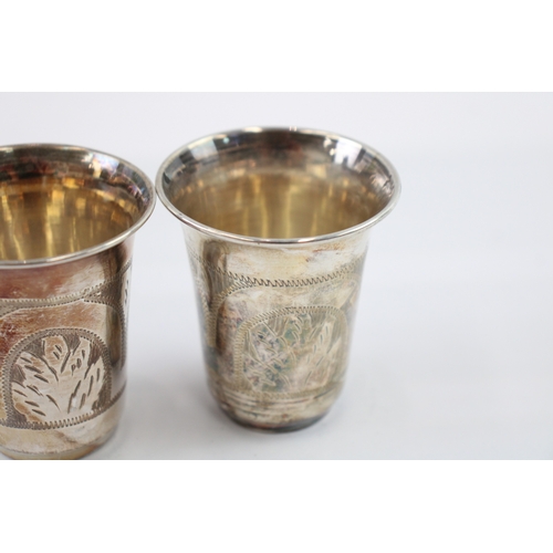 A pair of hallmarked sterling silver drinking cups - approx. gross ...