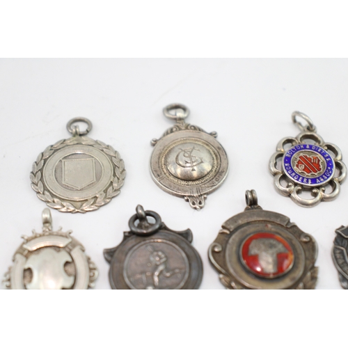 Seven hallmarked sterling silver fobs/medallions - approx. gross weight 64g
