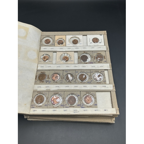 An album containing a collection of Australian coins