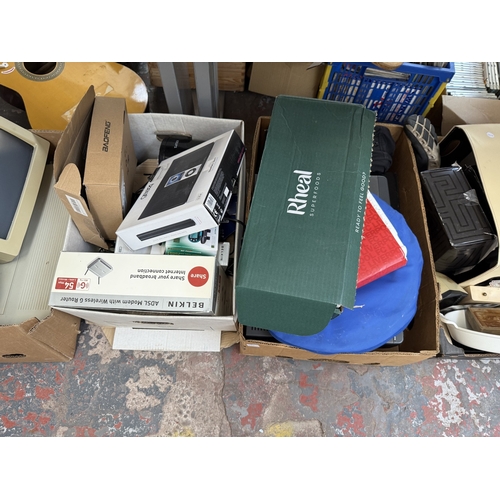 Seven boxes containing Gear4 iPod dock, Belkin wireless router ...