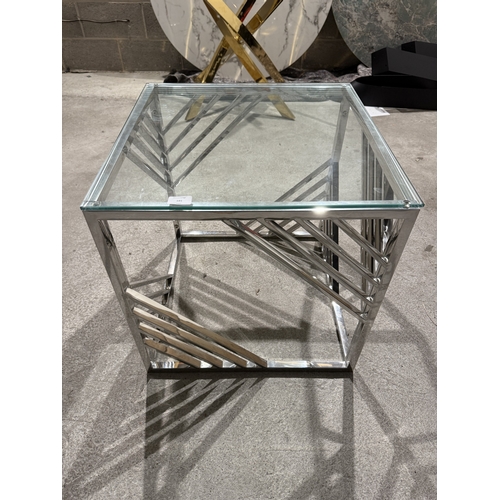 A glass and chrome square side table - approx. 55cm high x 55cm wide
