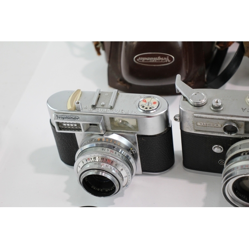 Five 35mm rangefinder cameras, one cased Zavod Arsenal Kiev 4 ...