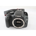 A Canon EOS 550D 18mp APS-C CMOS sensor DSLR camera body with Canon strap