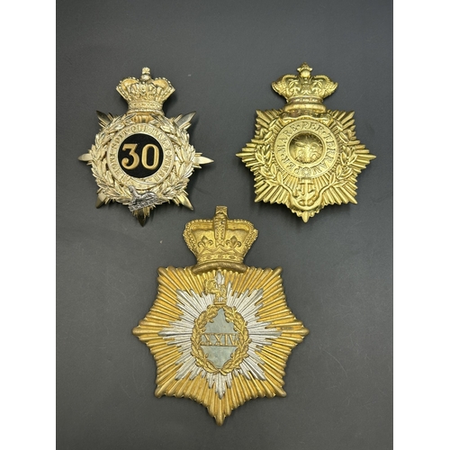 Three reproduction helmet plates to include Officers 24th Foot Regiment ...