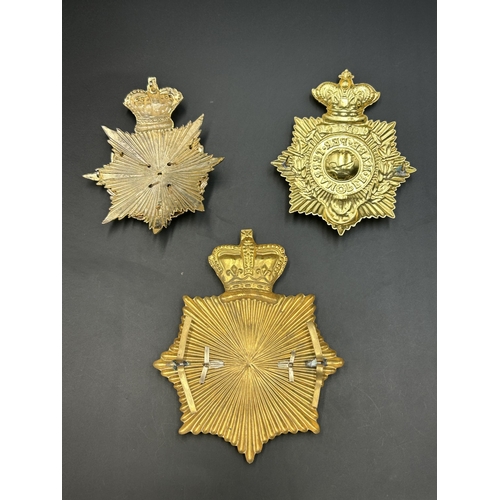 Three reproduction helmet plates to include Officers 24th Foot Regiment ...