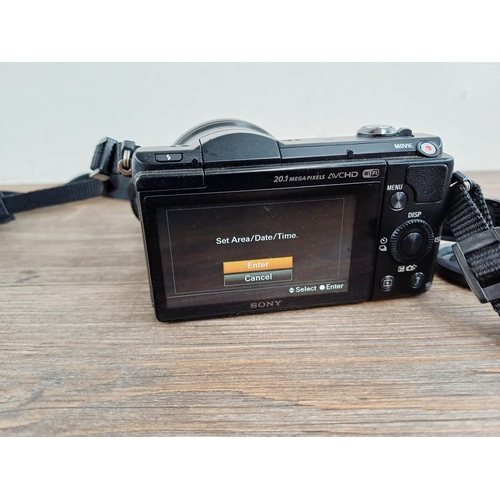 A Sony Alpha α5000 20.1mp APS-C CMOS sensor E-mount compact mirrorless ...