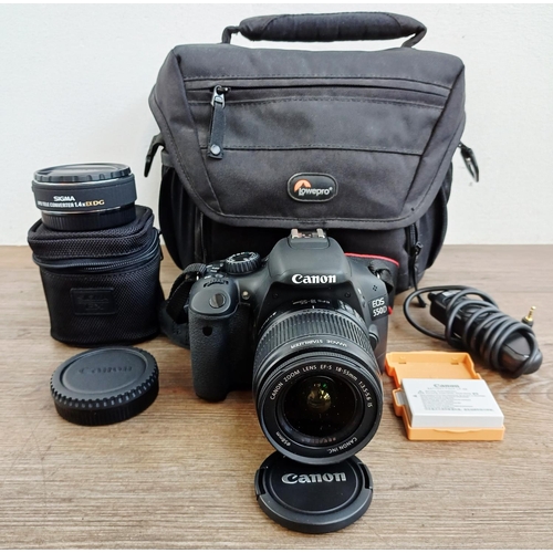 A Canon EOS 550D 18mp APS-C CMOS sensor DSLR camera fitted with EF-S 1: ...