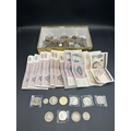 A collection of banknotes and coins with silver examples to include 92. ...