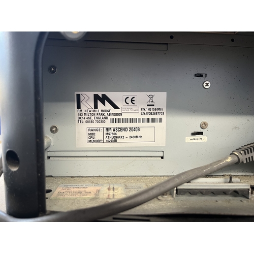 An RM Ascend 2040B Windows XP Home Edition desktop PC with keyboard, joystick and headphones