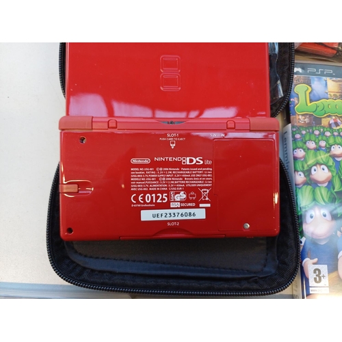 A collection of handheld gaming items to include two cased Nintendo DS ...