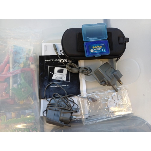 A collection of handheld gaming items to include two cased Nintendo DS ...