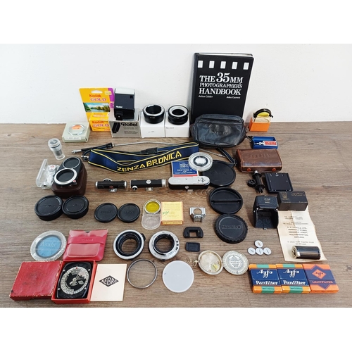 A collection of photography and camera accessories to include M42 and ...