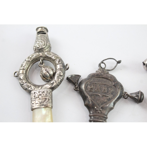 Four sterling silver baby rattles - approx. gross weight 89g