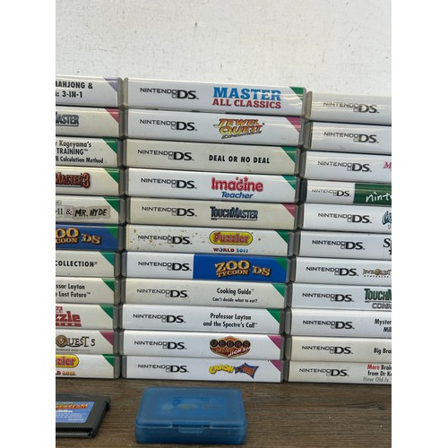 A large collection of Nintendo DS games together with a Nintendo DS ...