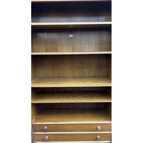 A pair of late 20th century oak veneer five tier bookcases - approx ...