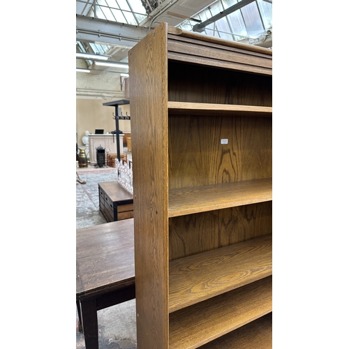 A pair of late 20th century oak veneer five tier bookcases - approx ...