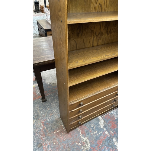 A pair of late 20th century oak veneer five tier bookcases - approx ...