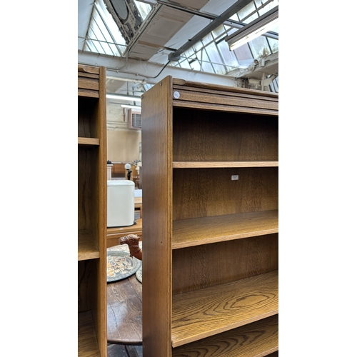 A pair of late 20th century oak veneer five tier bookcases - approx ...