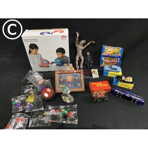 Collection of toys and framed badges