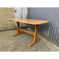 An Ercol light elm refectory dining table 154x84x77