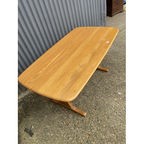 An Ercol light elm refectory dining table 154x84x77